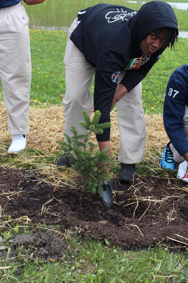 Tree Planting at University Loft on Arbor Day - University Loft Company